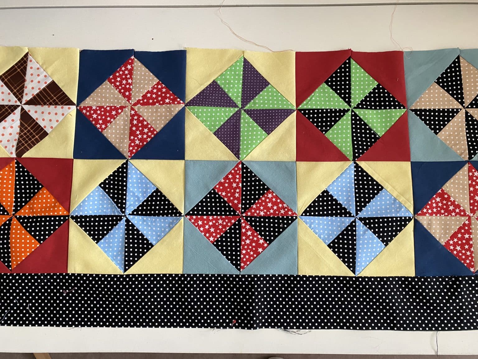 Glowing Pinwheels Quilt and Pattern (not quite Amish) | susies-scraps.com