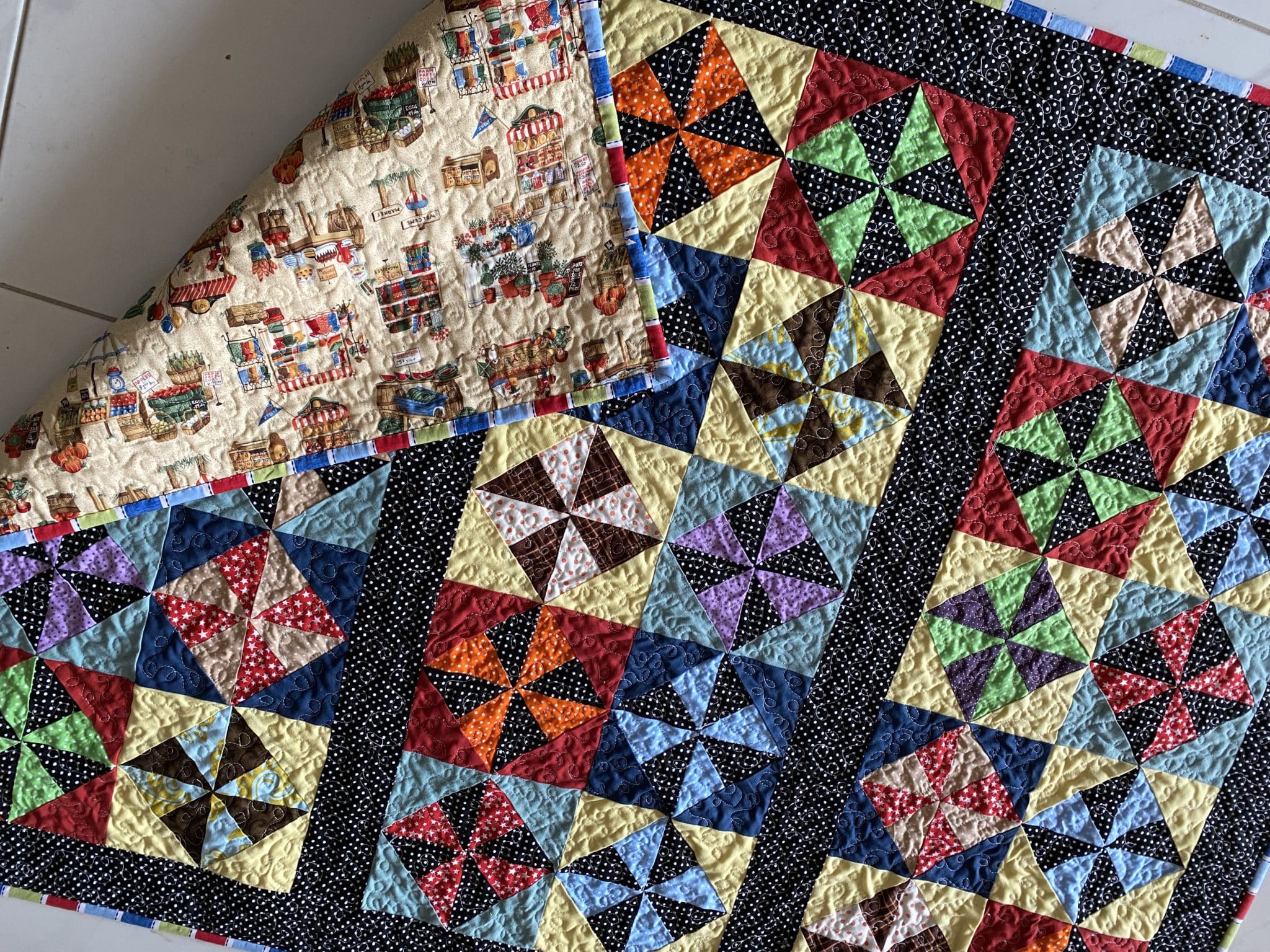 Glowing Pinwheels Quilt and Pattern (not quite Amish) | susies-scraps.com